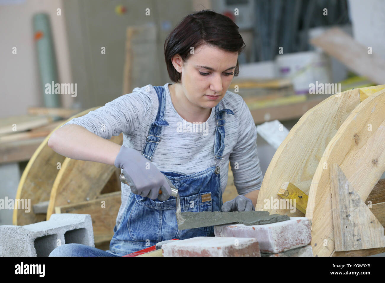 Young woman in masonry professional school Stock Photo - Alamy
