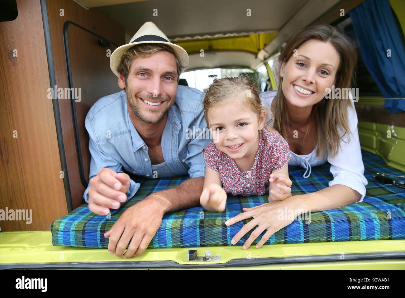 Portrait of cheerful family having fun in camper Stock Photo - Alamy