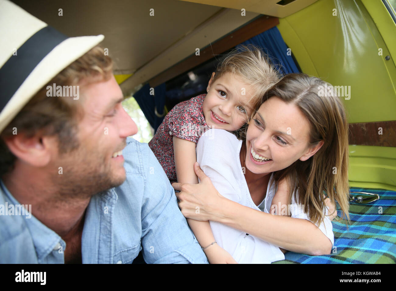 Portrait of cheerful family having fun in camper Stock Photo - Alamy