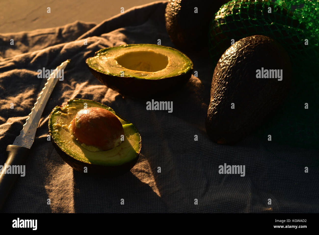 ripe avocado cut in half Stock Photo - Alamy