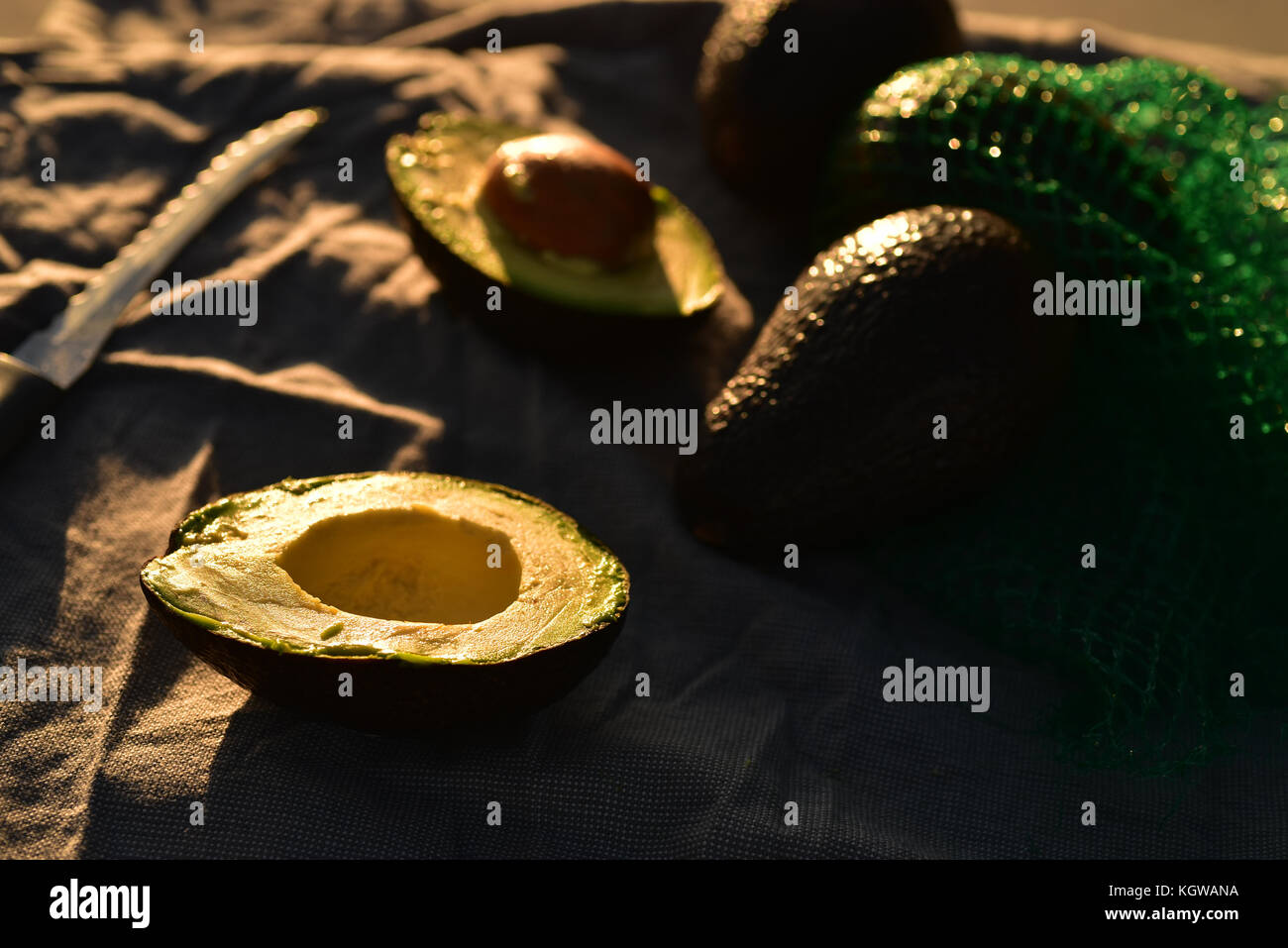 ripe avocado cut in half Stock Photo - Alamy