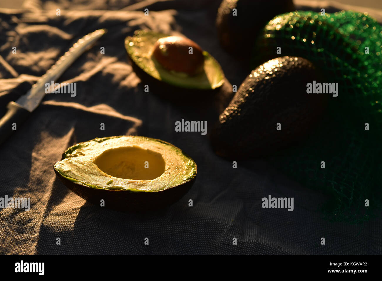 ripe avocado cut in half Stock Photo - Alamy
