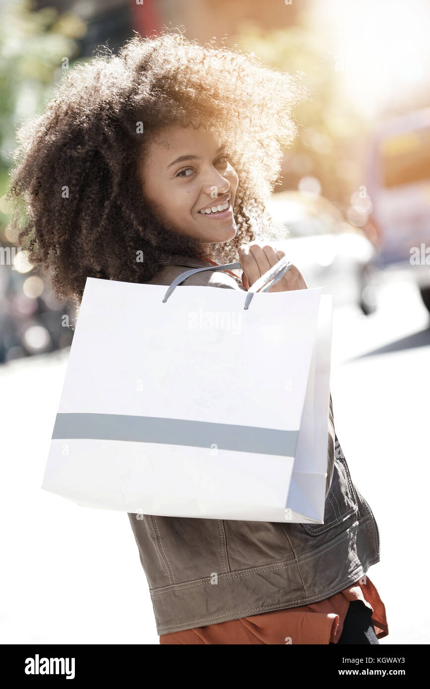 Cheerful girl doing shopping in New York City Stock Photo - Alamy