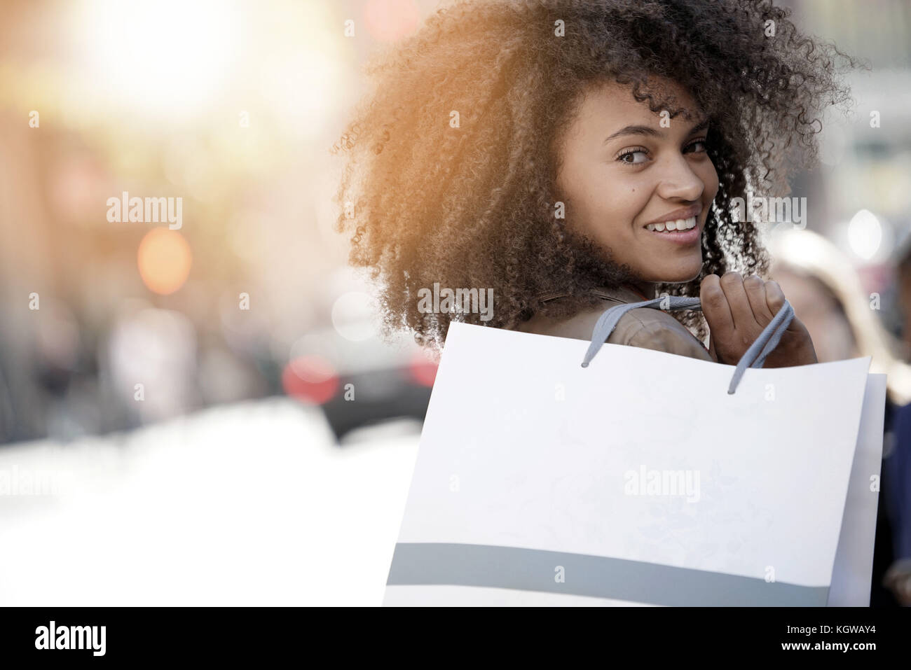 Cheerful girl doing shopping in New York City Stock Photo - Alamy