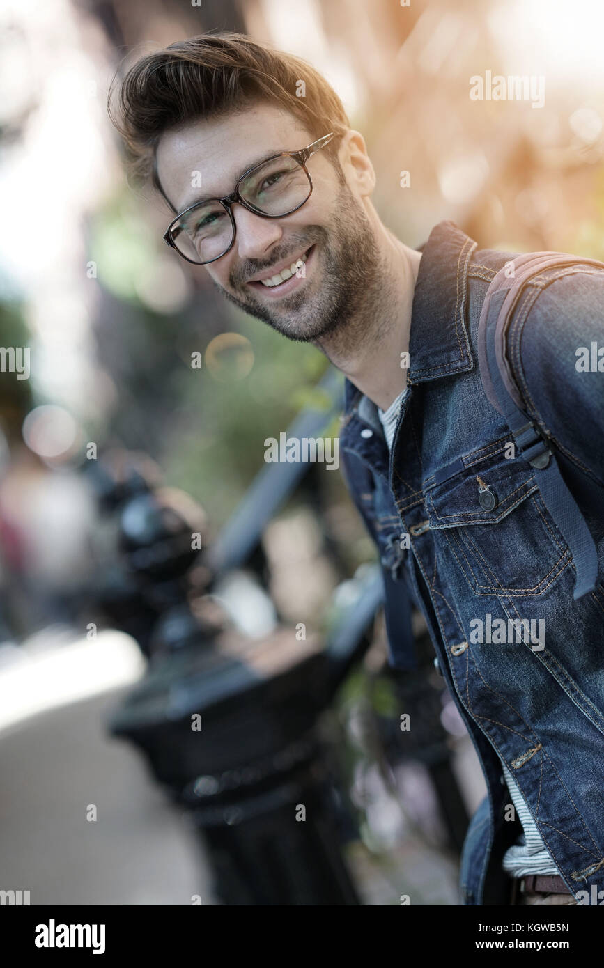 Cheerful man walking in the street, NYC tour Stock Photo - Alamy