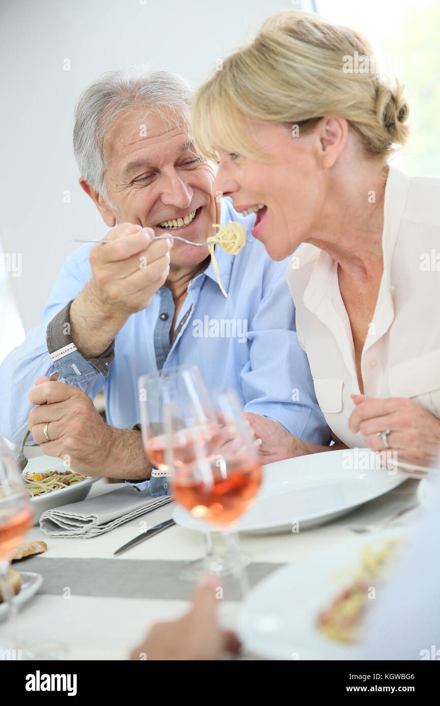 Retired couple enjoying meal at home hi-res stock photography and ...