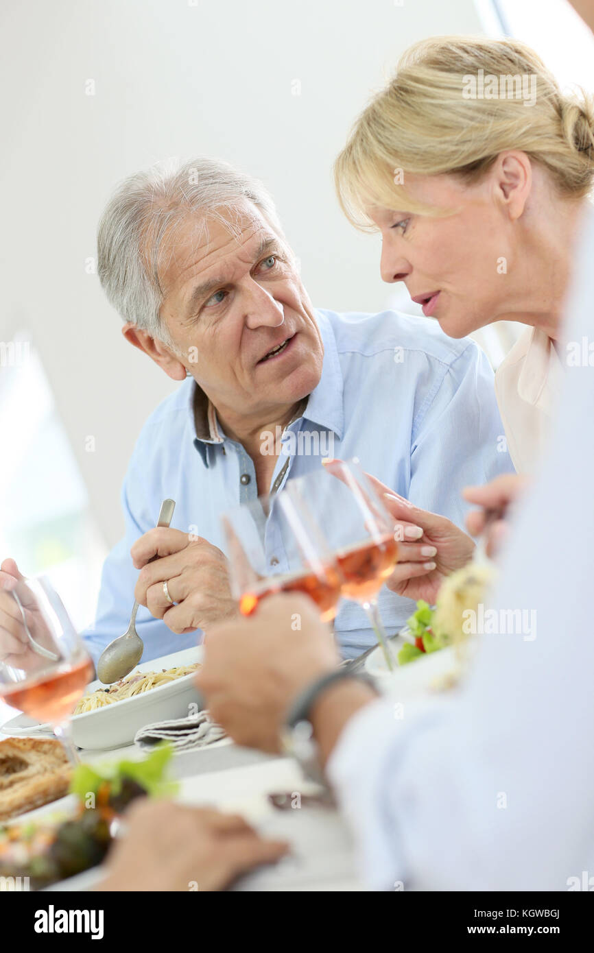 Senior couple discussing during lunch time Stock Photo - Alamy
