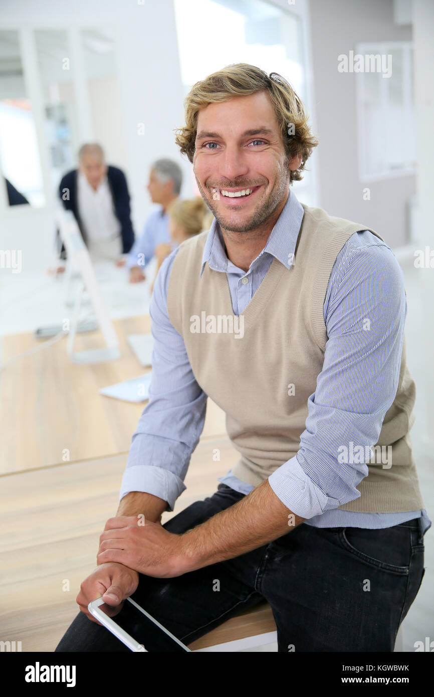Portrait of young instructor in business class Stock Photo - Alamy