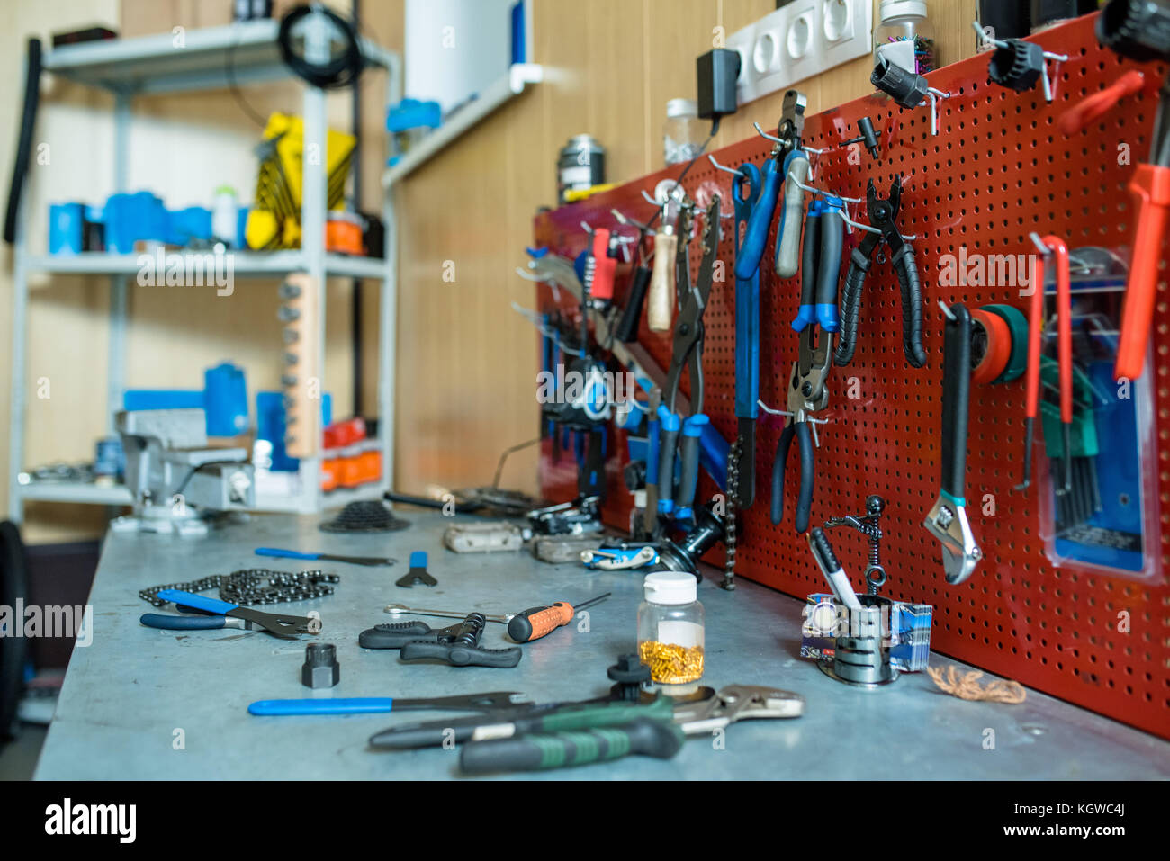 Toolkit panel on wall and workplace of repairman with diy tools Stock ...
