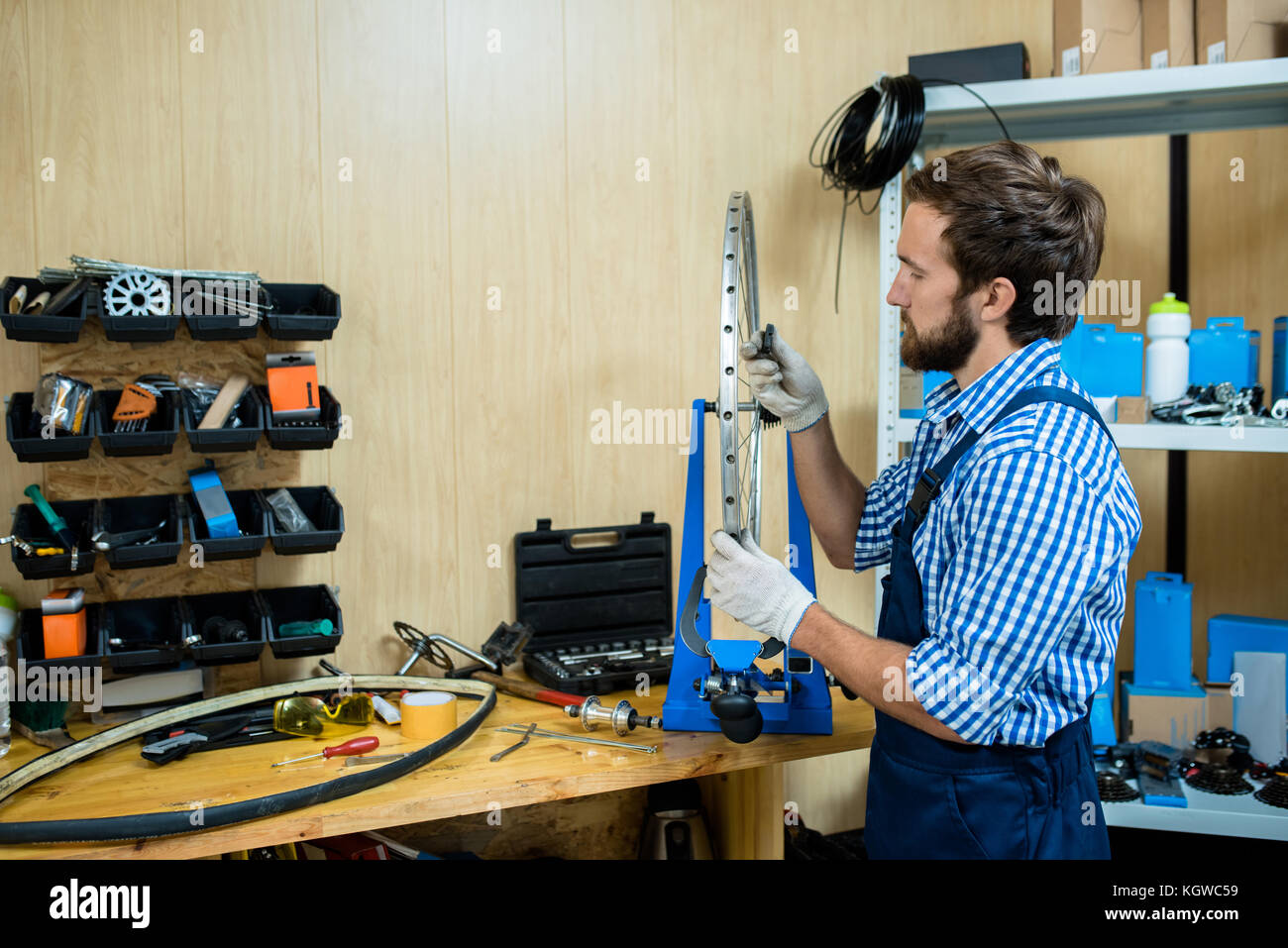 Man with bike in bikeshop hi-res stock photography and images - Alamy