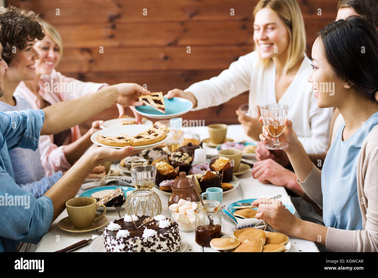 One of guests asking for slice of sweet pie during home celebration of ...