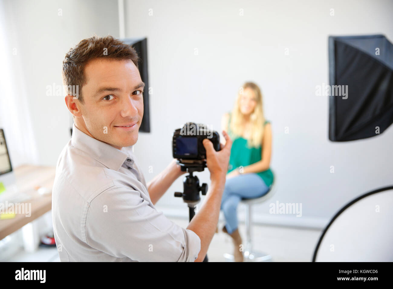 Fashion photographer at work in studio Stock Photo - Alamy