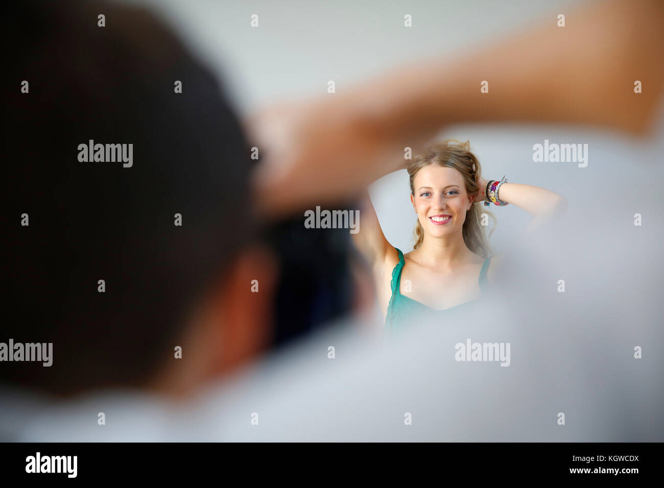 Back view of photographer photographing model Stock Photo - Alamy
