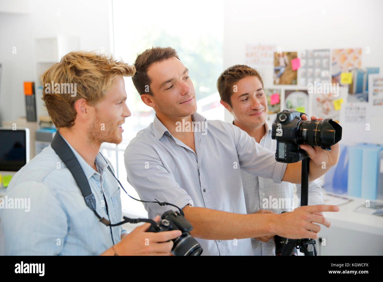 Photographer with students in training class Stock Photo - Alamy
