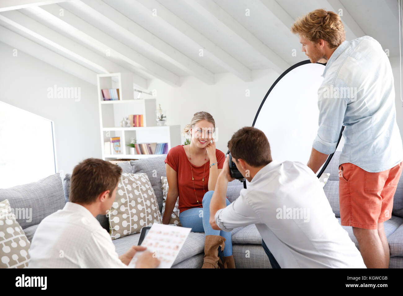 Team of photographers on a shooting day in studio Stock Photo - Alamy
