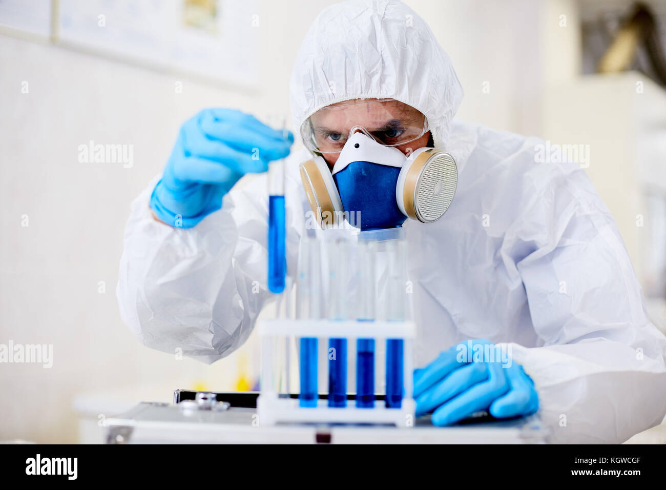 Scientist working with hazardous liquids in flasks in his lab Stock ...