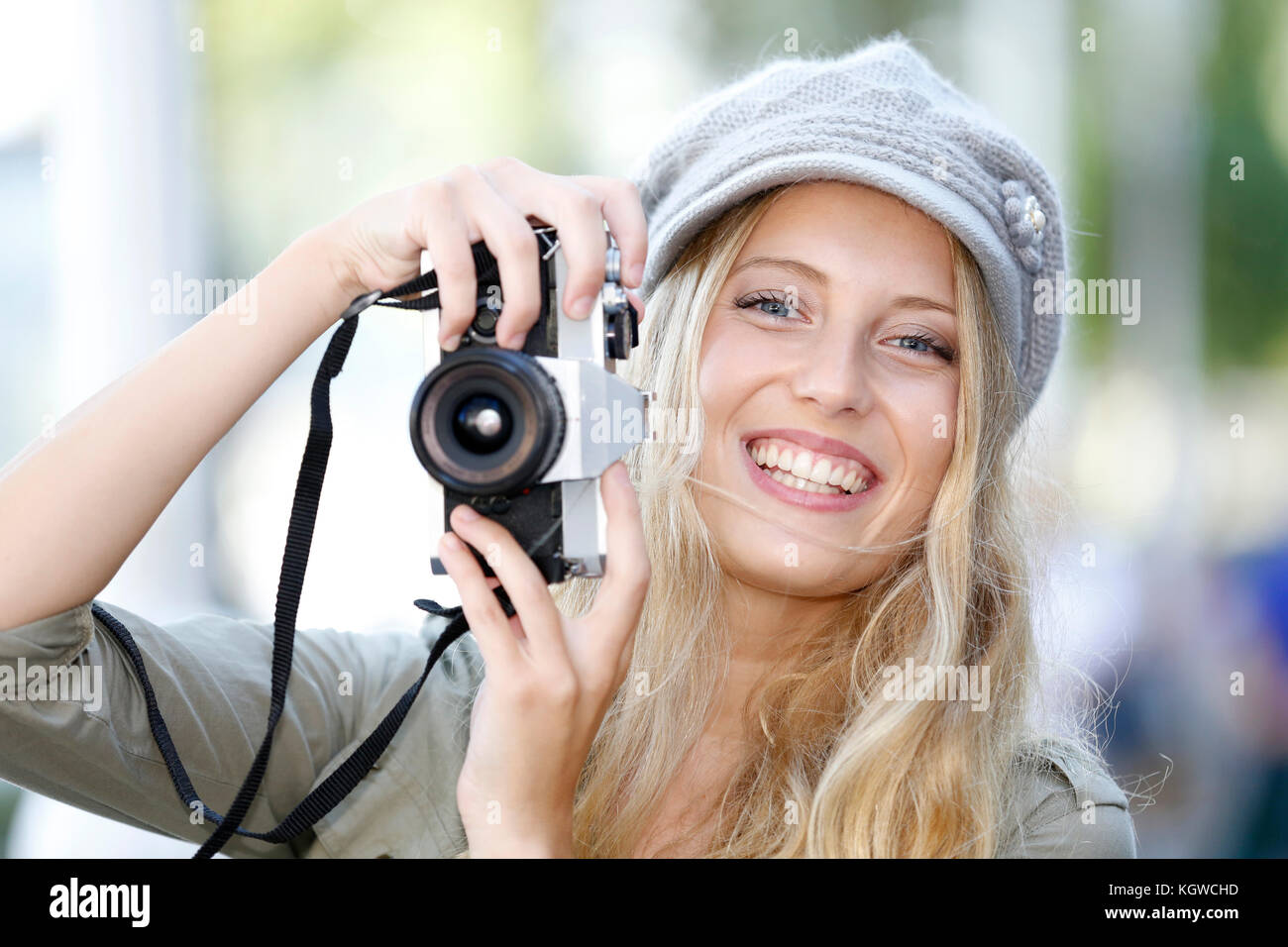 Smiling girl taking pictures outdoors hi-res stock photography and ...
