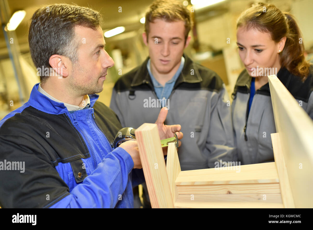 Group of students in woodwork training course Stock Photo - Alamy