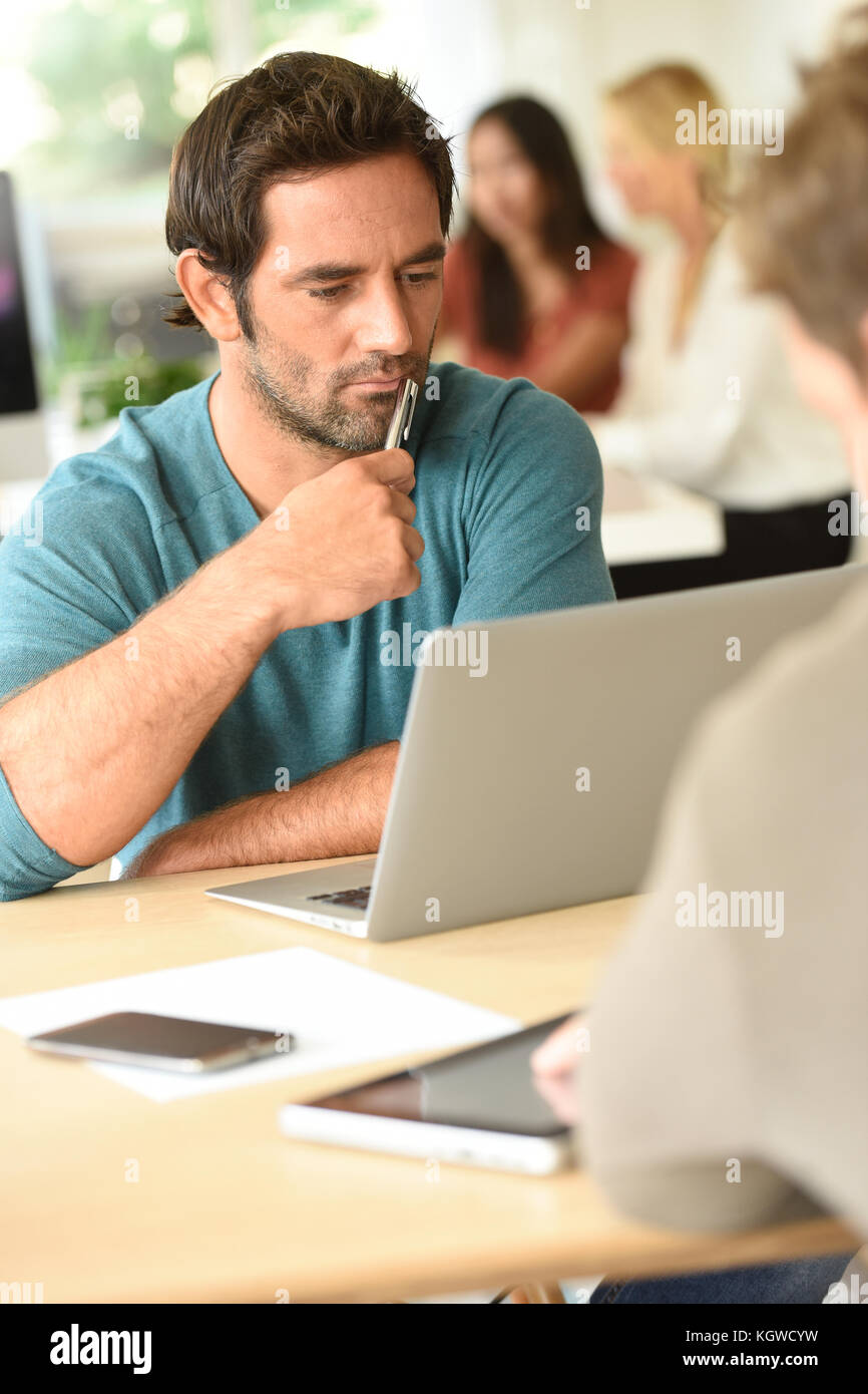 Businessman in office meeting with client Stock Photo - Alamy