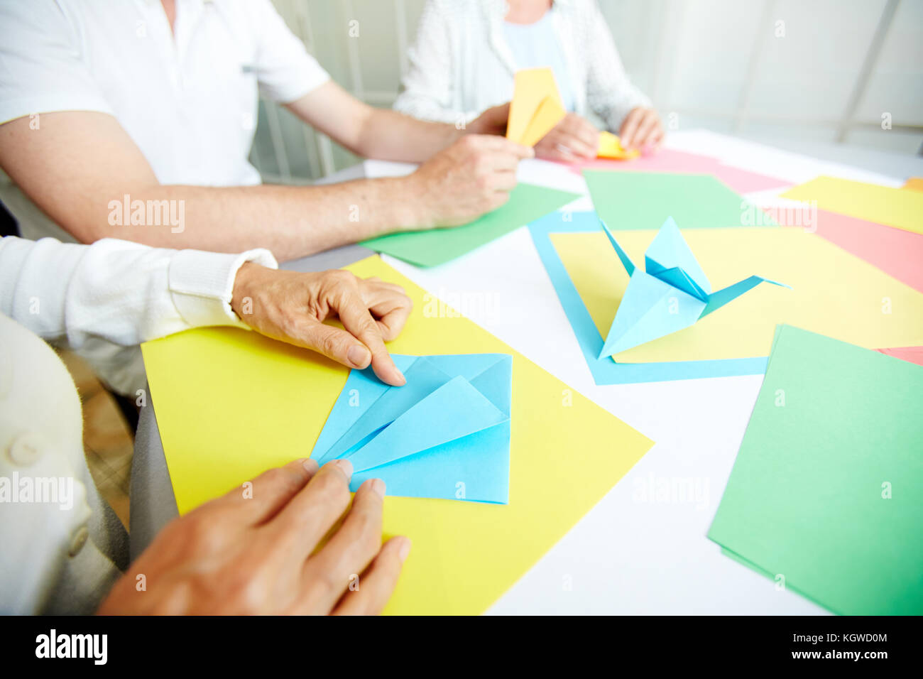 Woman folding paper origami hi-res stock photography and images - Alamy