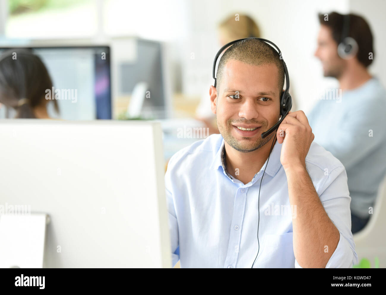 Customer service operator working in office Stock Photo - Alamy