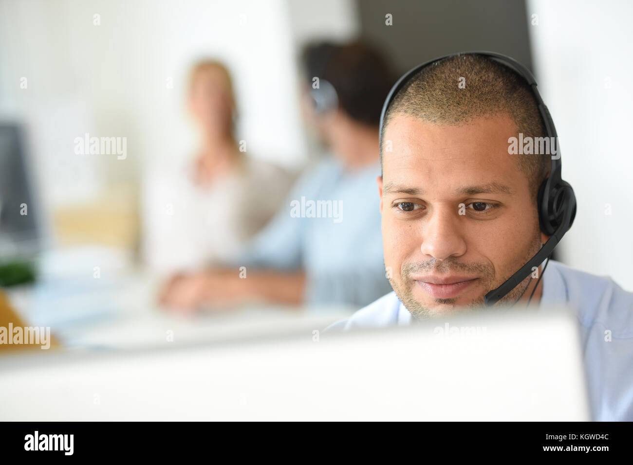 Customer service operator working in office Stock Photo - Alamy