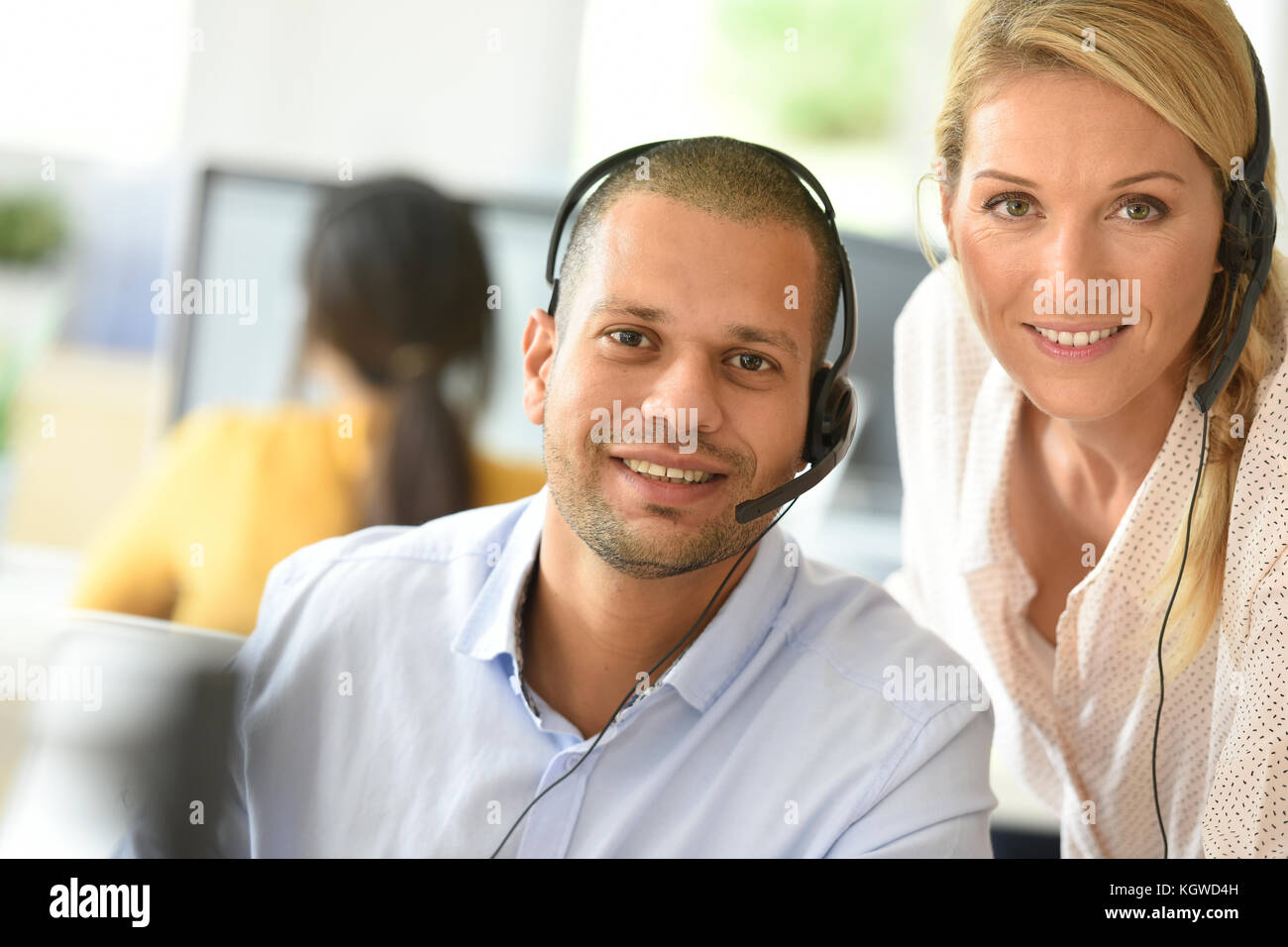 Teleoperator in office with manager Stock Photo - Alamy