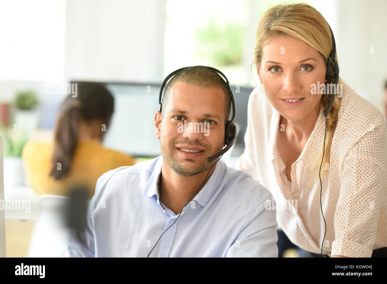 Teleoperator in office with manager Stock Photo - Alamy