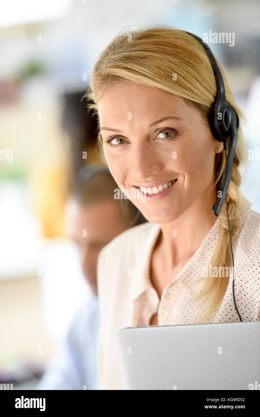 Closeup of customer service manager standing in call center Stock Photo ...