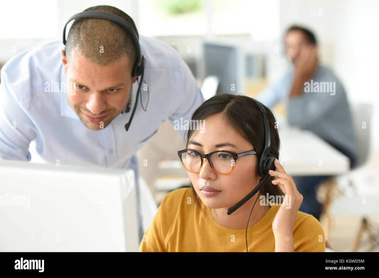 Smiling customer office assistant with manager in office Stock Photo ...