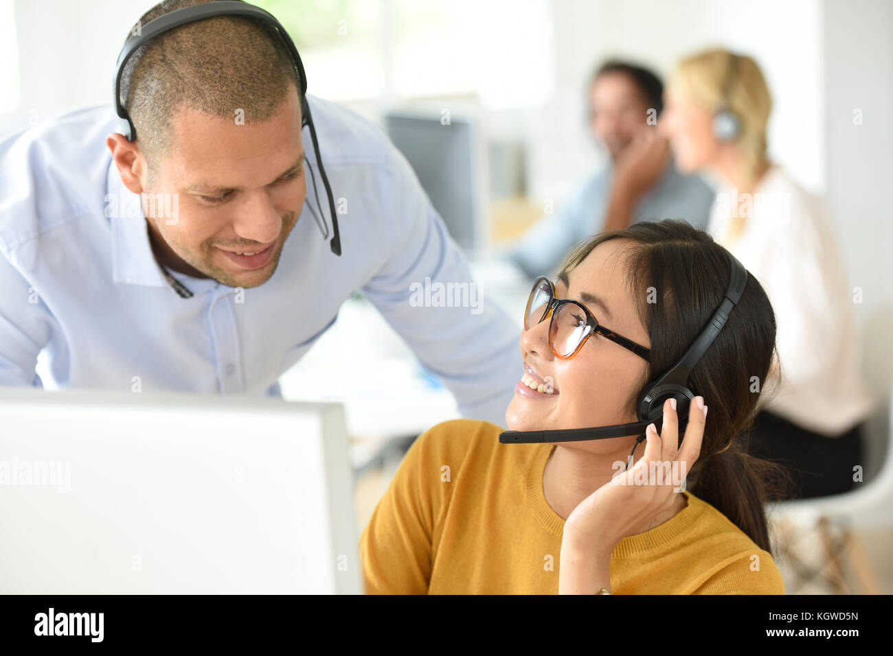 Smiling customer office assistant with manager in office Stock Photo ...