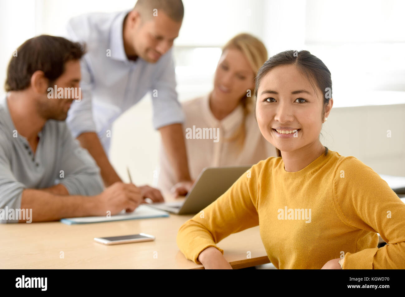 Portrait of smiling woman attending work meeting Stock Photo - Alamy