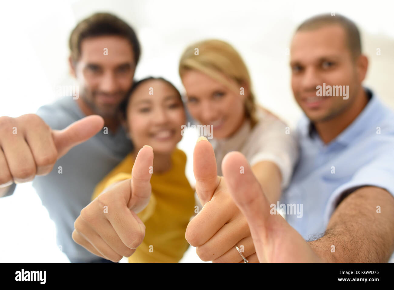 Group of people showing thumbs up to camera Stock Photo - Alamy