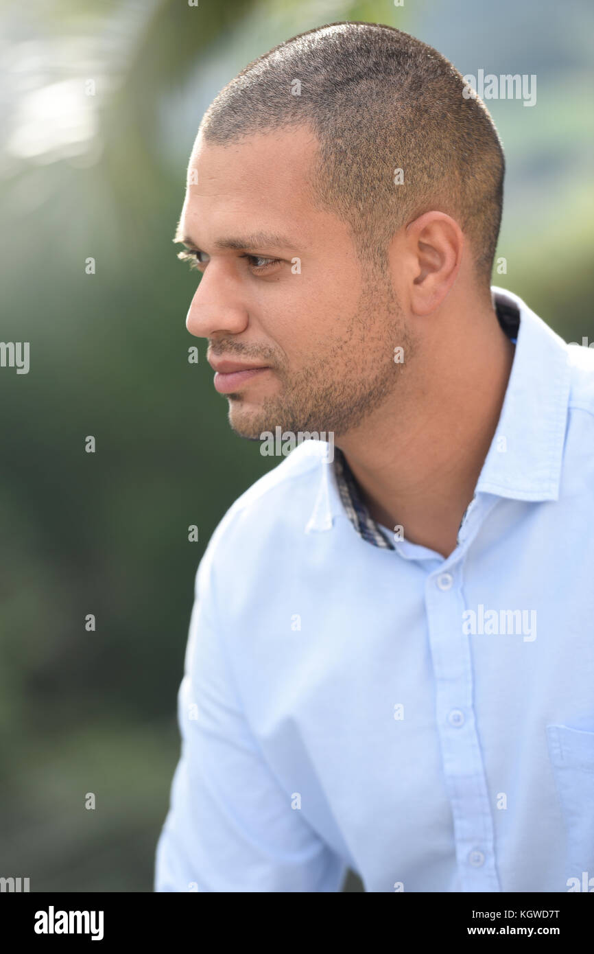 portrait of hispanic guy standing outside Stock Photo - Alamy