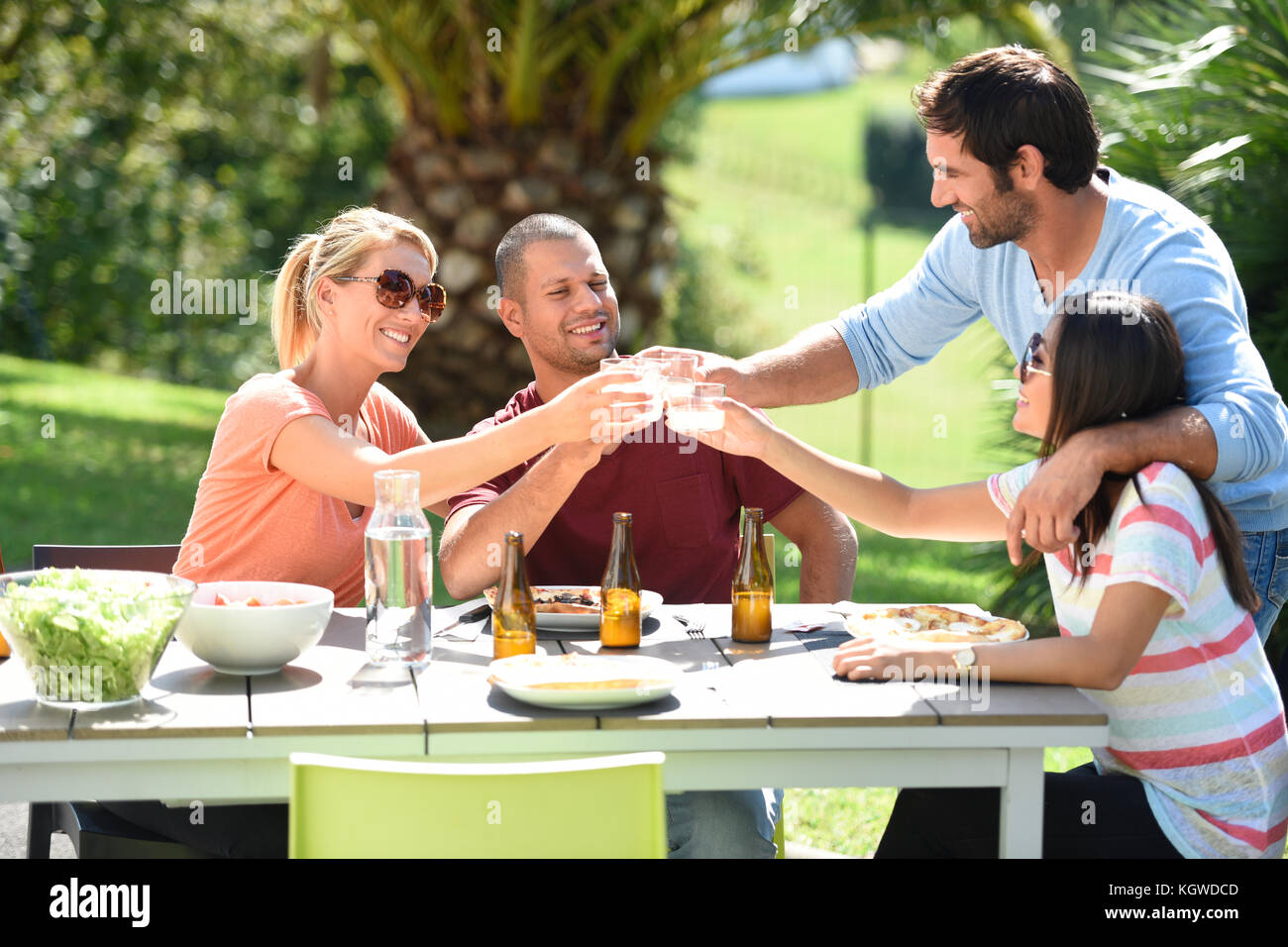 Friends having lunch outside on a sunny day Stock Photo - Alamy