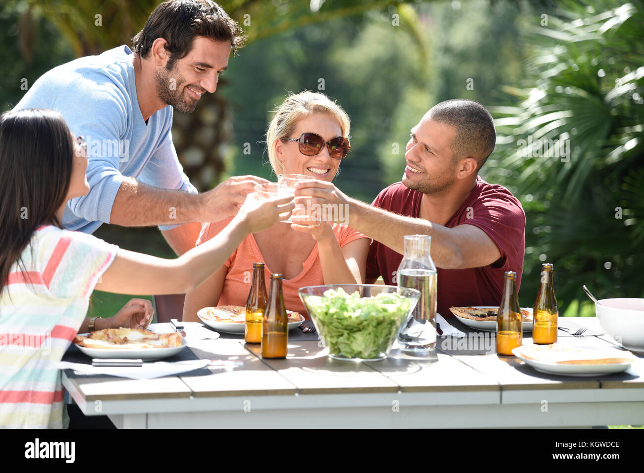 Friends having lunch outside on a sunny day Stock Photo - Alamy