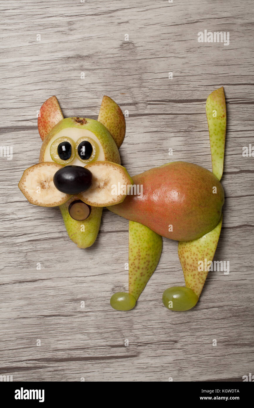 Cat made with fruits on wooden background Stock Photo - Alamy