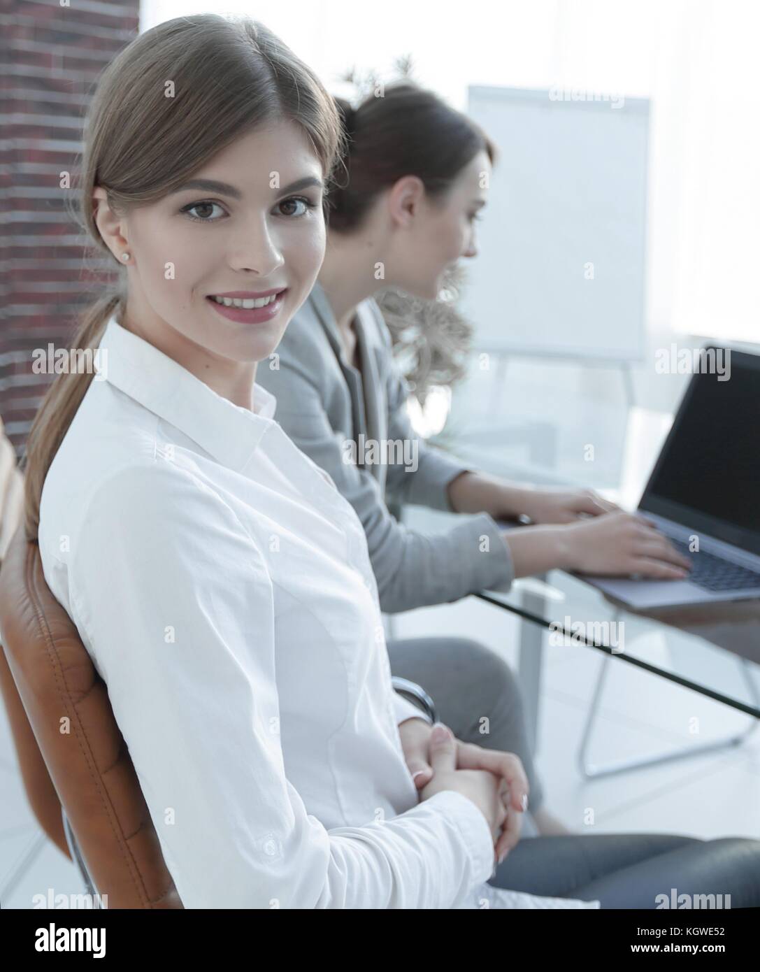 office workers sitting behind a Desk Stock Photo - Alamy