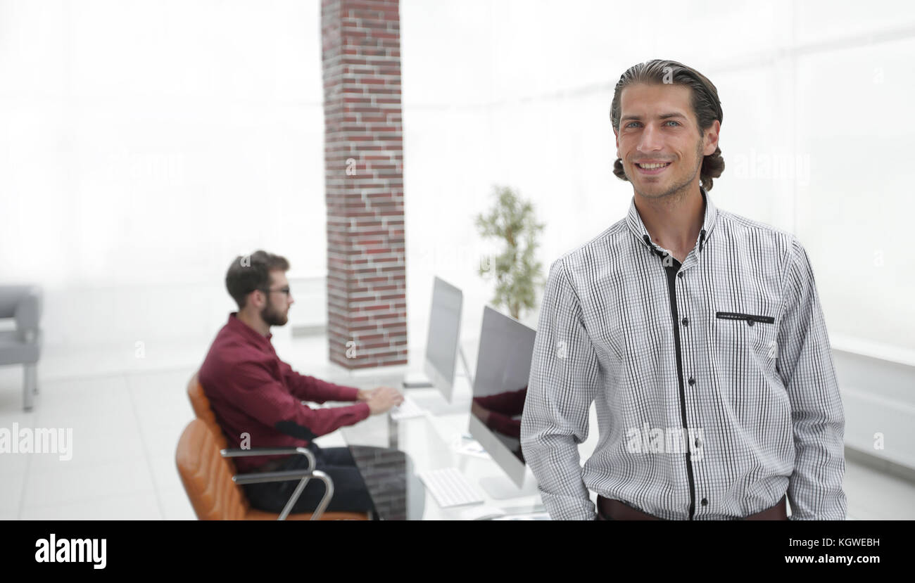 successful employee ,standing in the office Stock Photo - Alamy