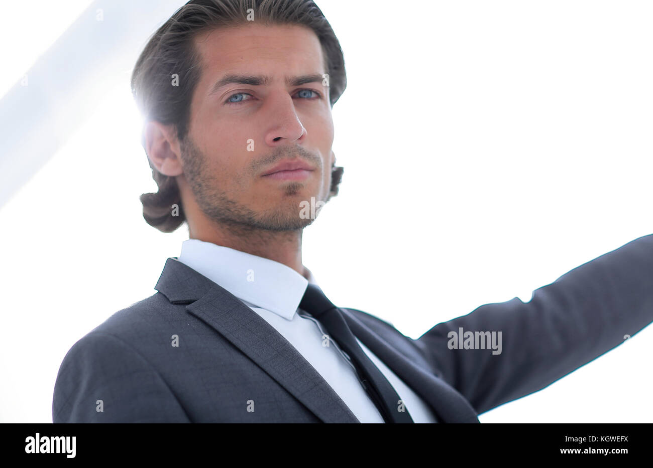 Executive businessman pointing at copy space Stock Photo - Alamy