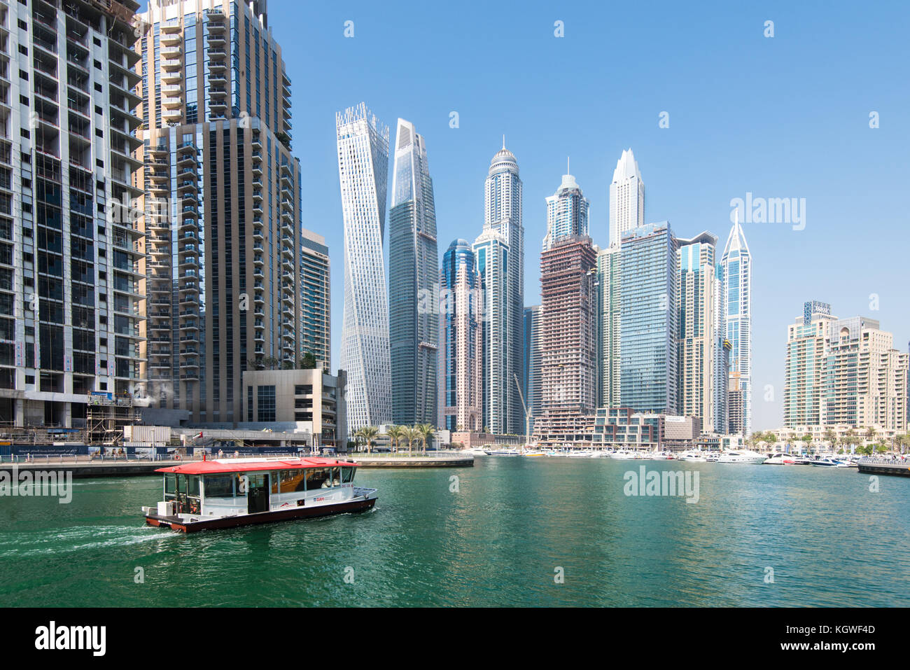 DUBAI, UAE - 31OCT2017: A Water Bus moving towards the Iconic towers of ...