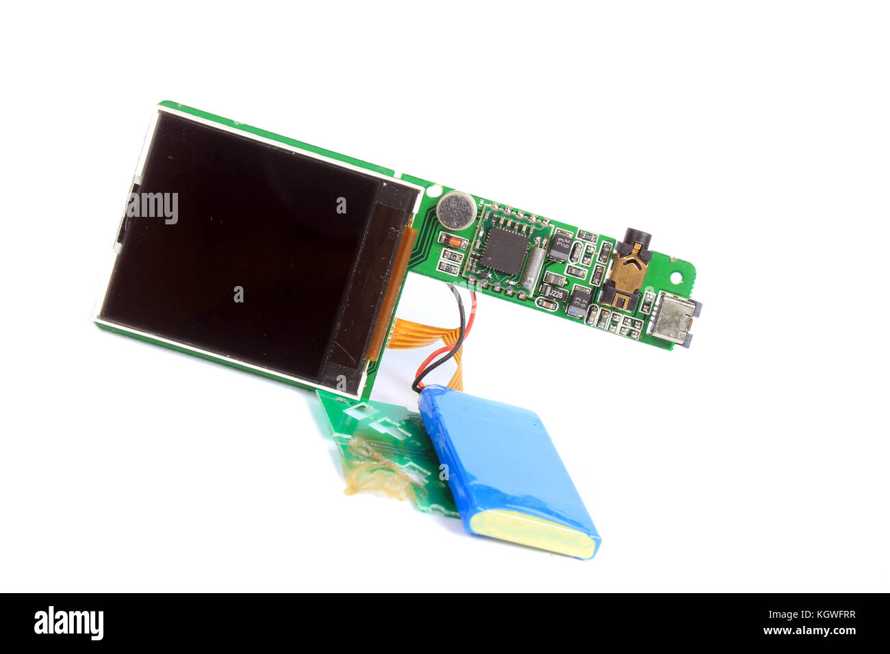 An old MP3 player stripped down showing its components like circuit ...