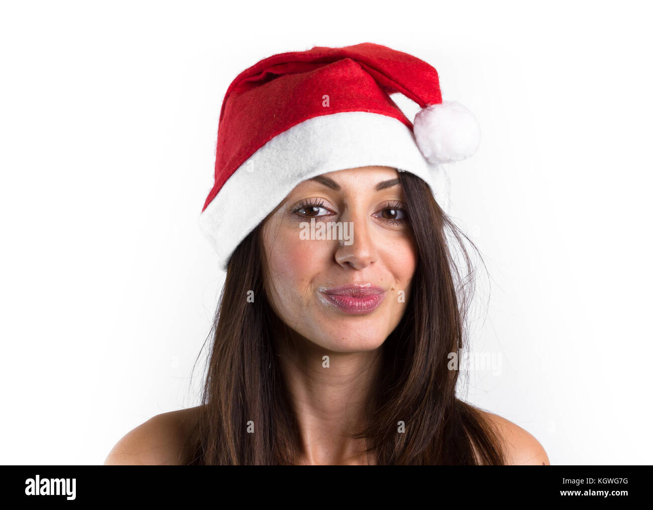 Beautiful female model, with brown hair, wear santa hat. Isolated over ...