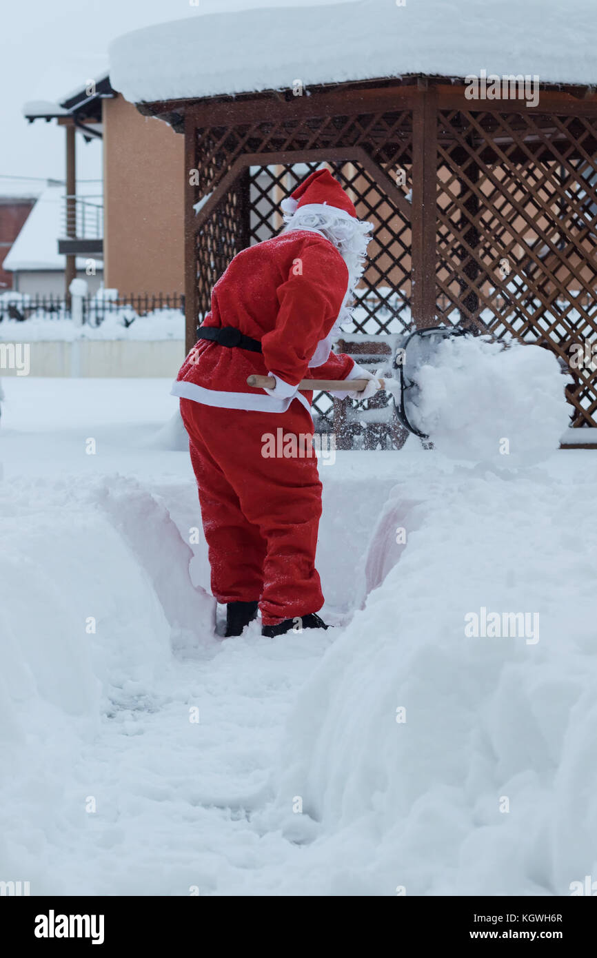 santa claus taking with shovel snow away to make the way free Stock ...
