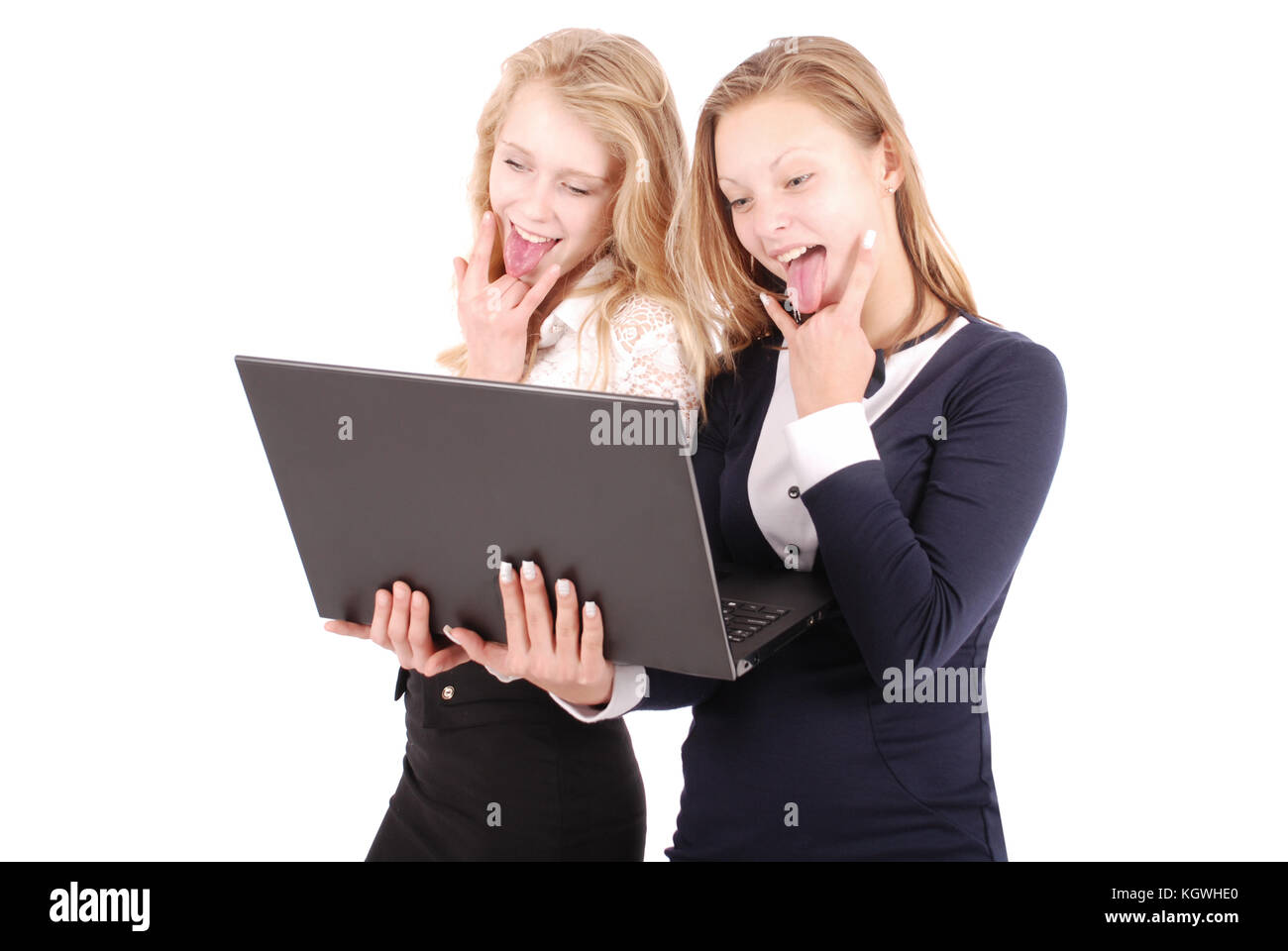 Two shocked girls using laptop isolated on a white background Stock ...