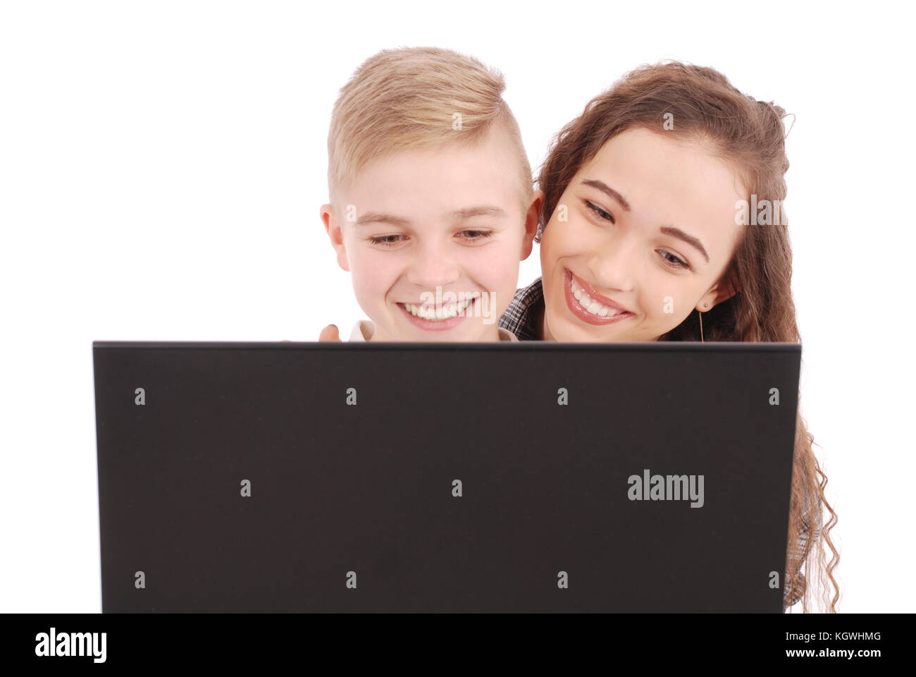 Boy and girl using a laptop isolated on white background Stock Photo ...