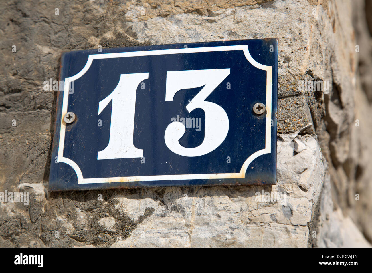 Number Thirteen on Stone Wall Stock Photo - Alamy
