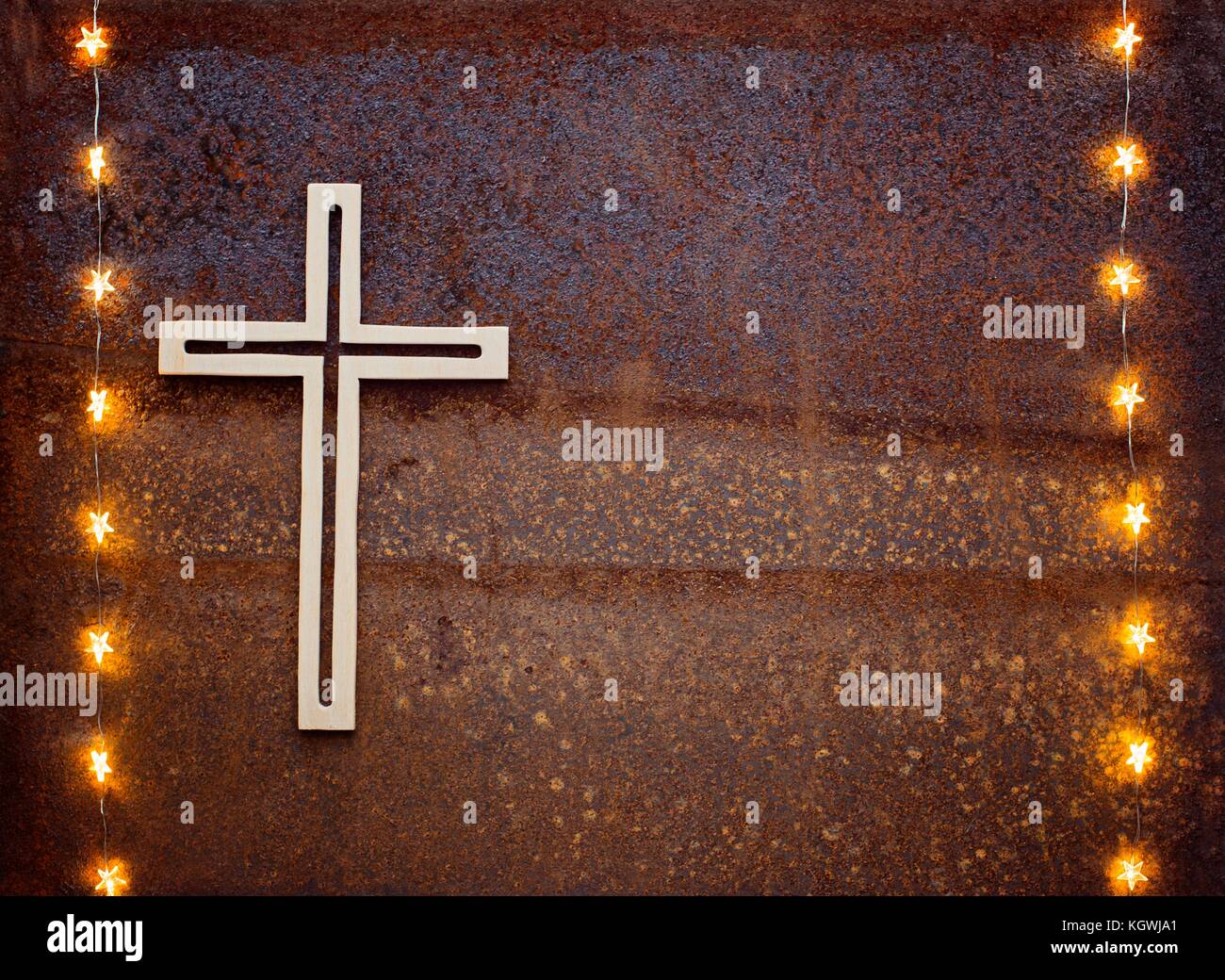 Wooden crucifix on rusty iron background with lights Stock Photo - Alamy