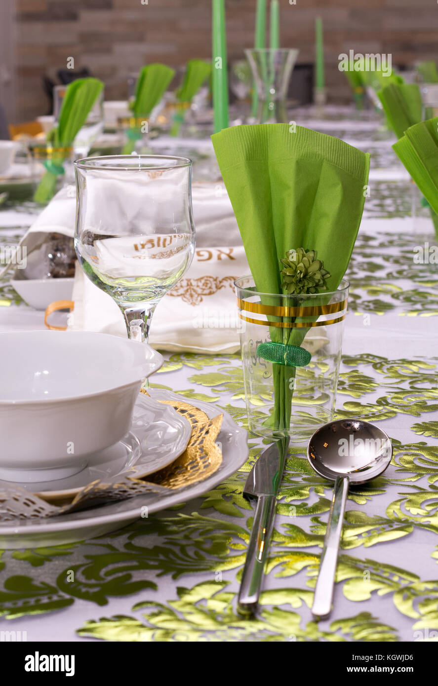 Modern Passover Seder table with green and gold decorations in Tel Aviv ...