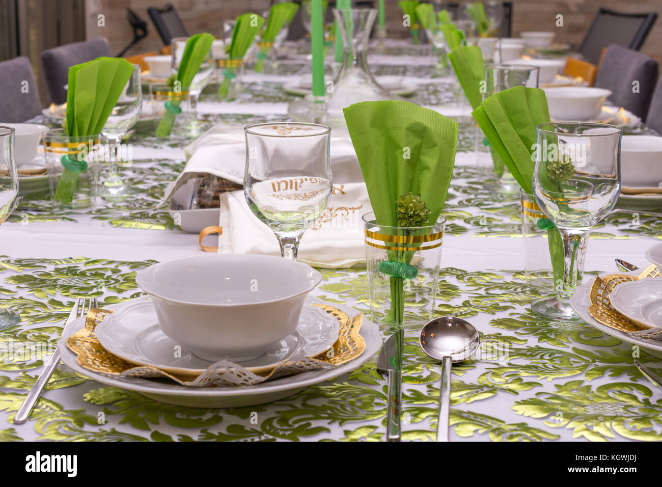 Modern Passover Seder table with green and gold decorations in Tel Aviv ...